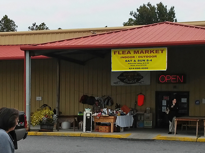 The unassuming orange exterior of Antique Depot stands like a treasure chest waiting to be opened, with storm clouds adding dramatic flair to your bargain-hunting adventure.