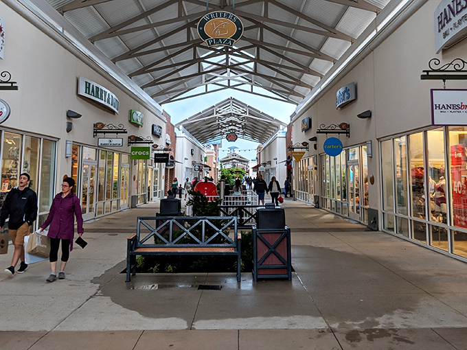 The brick facade of Philadelphia Premium Outlets welcomes bargain hunters like an old friend promising treasures within. LOFT beckons from just beyond the entrance.