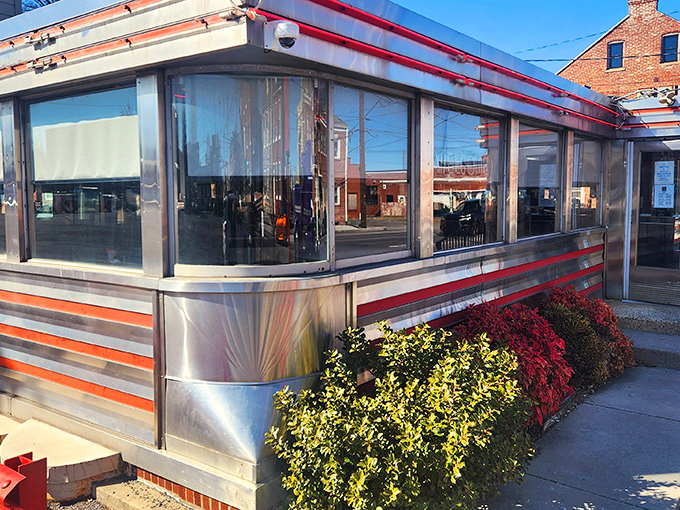 Neptune Diner's gleaming stainless steel exterior with classic red trim isn't just nostalgic&mdash;it's a time machine disguised as a restaurant. Comfort awaits inside. 