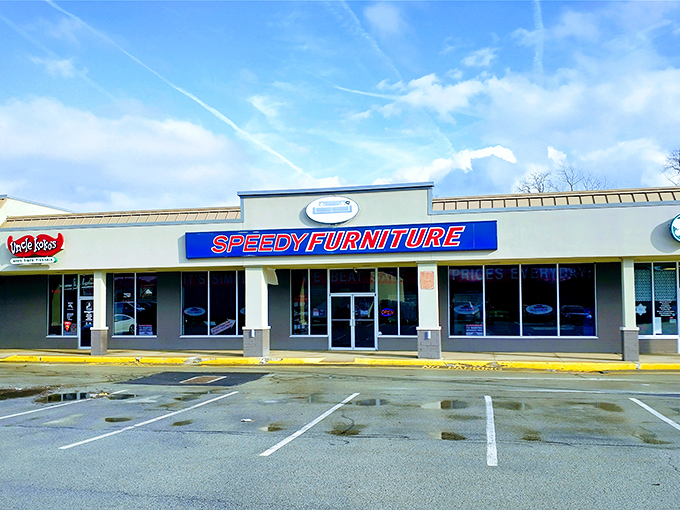 The blue and red storefront beckons like a furniture oasis in the strip mall desert. No pretension, just promises of comfortable living ahead.