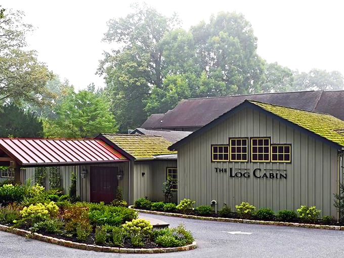 The Log Cabin's exterior glows with warm invitation at twilight, like a beacon of culinary promise in Pennsylvania's countryside.