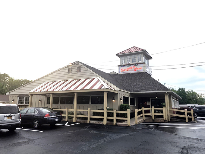 The lighthouse-inspired cupola atop Smuggler's Cove beckons hungry travelers like a beacon of seafood salvation in the Pocono Mountains. 