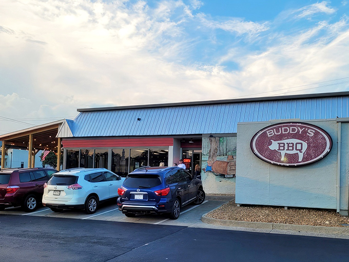 The modest exterior of Buddy's BBQ belies the flavor explosion waiting inside, like a treasure chest disguised as a simple wooden box.