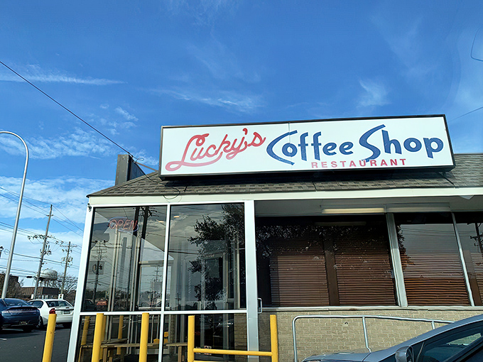 The iconic Lucky's sign welcomes hungry pilgrims like a beacon of breakfast hope. This unassuming exterior houses Delaware's most ambitious egg creations.