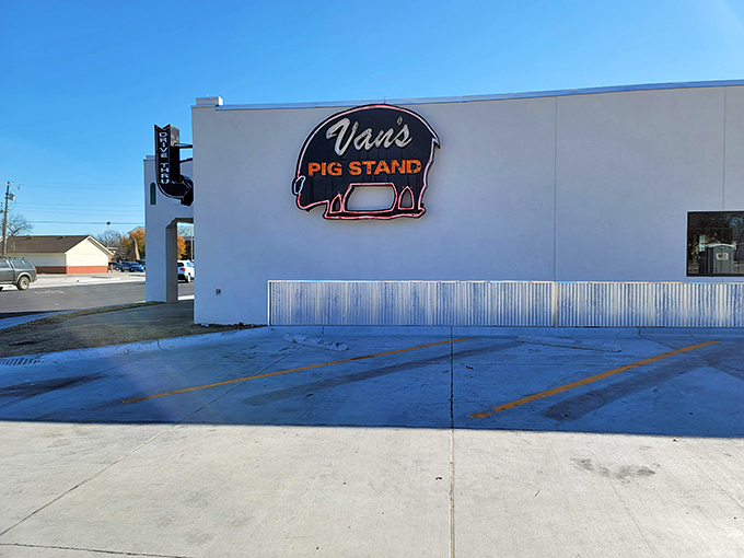 That iconic neon pig sign isn't just advertising – it's a beacon of hope for barbecue pilgrims seeking smoky salvation in Norman.