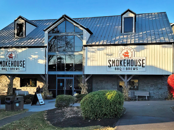 The barn-inspired exterior of Smokehouse BBQ & Brews stands proudly against the Pennsylvania sky, a beacon of smoked meat salvation in Amish Country. 