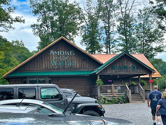 The rustic cabin exterior of Smoke on the Water beckons like a barbecue beacon in the West Virginia hills. That aroma you're smelling? Worth the drive alone.