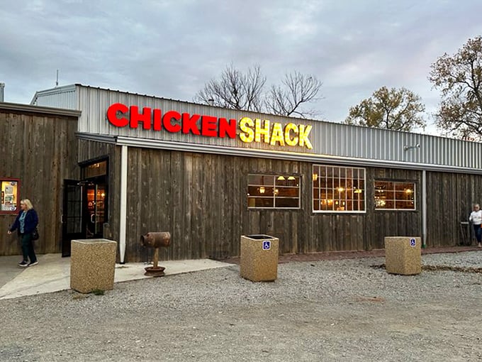 Route 66 nostalgia meets finger-lickin' reality at this weathered roadside gem. The red door practically winks at you, promising delicious secrets inside.