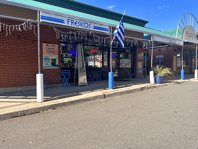The iconic blue awning of Freskos stands out like a beacon of Mediterranean promise, complete with sunny outdoor seating for those perfect Connecticut afternoons.