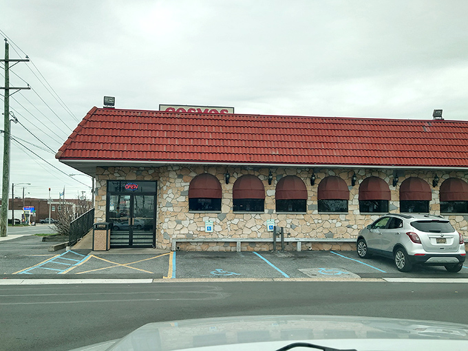 The distinctive red roof and stone facade of Cosmos Restaurant & Bar stands as a Wilmington landmark, promising Greek-American comfort food that delivers on nostalgia and flavor.