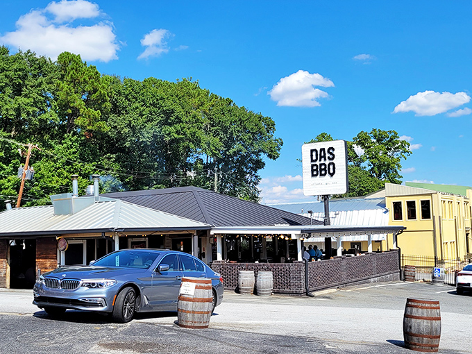 That classic barbecue joint exterior promises serious smoky business happening inside those welcoming doors.