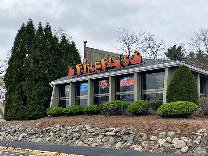The bright orange Firefly's sign beckons like a barbecue lighthouse, promising smoky salvation to weary travelers on the Marlborough roadside. 