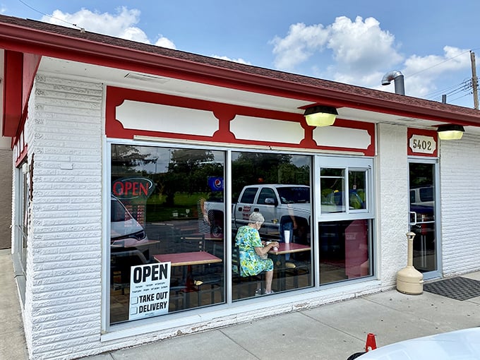 The modest red and white exterior of Hartland Bar-B-Que speaks the universal truth of BBQ: the less fancy the building, the better the meat inside.