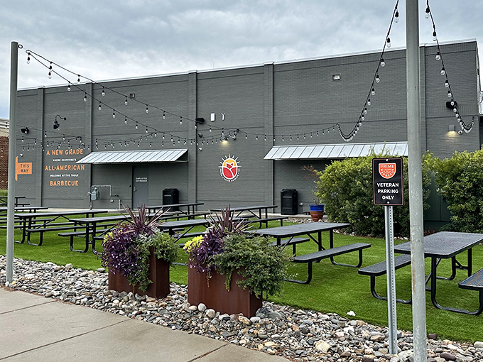 Modern meets mouthwatering at Prime Barbecue's sleek Knightdale exterior. The orange shield logo beckons like a barbecue bat-signal to hungry heroes everywhere.
