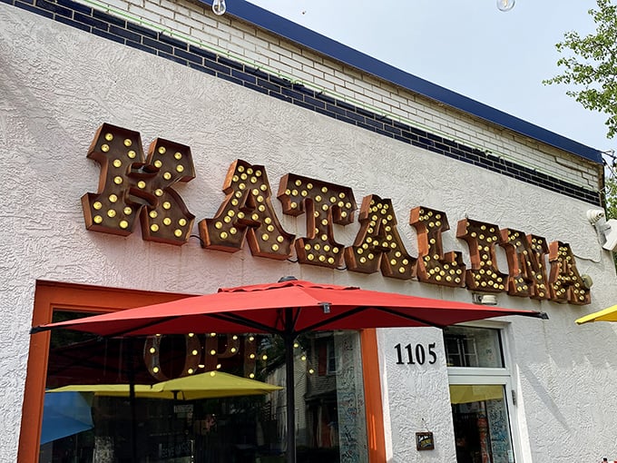 The marquee-style sign beckons like a carnival of culinary delights, promising pancake balls that are worth every minute of the inevitable wait.