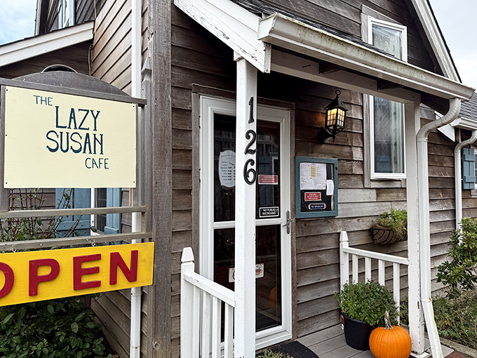 The weathered cedar siding and cheerful yellow sign say "coastal comfort food ahead." This little house holds big breakfast dreams.
