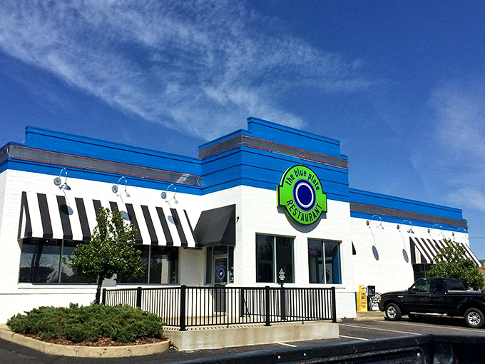 The blue and white exterior of The Blue Plate stands out like a beacon of hope for hungry travelers. This unassuming building holds culinary treasures within.