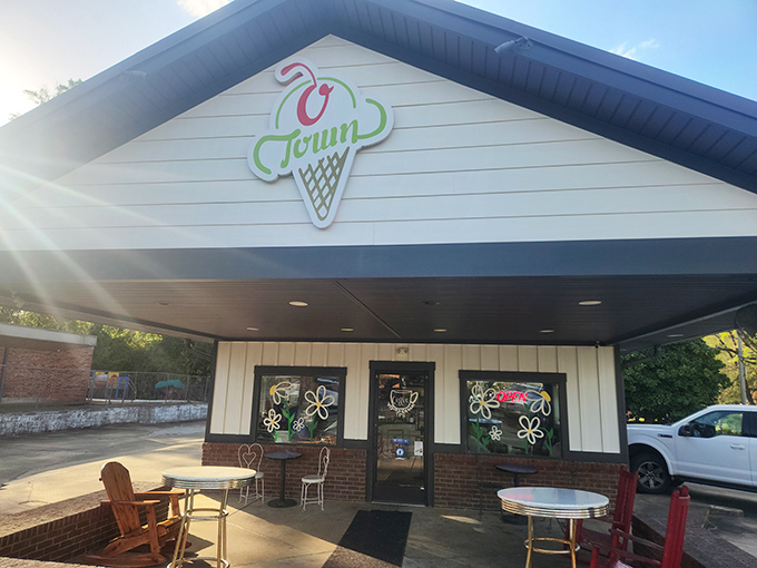 The classic ice cream parlor facade of O Town beckons like a sweet mirage on a hot Alabama day, complete with charming outdoor seating.