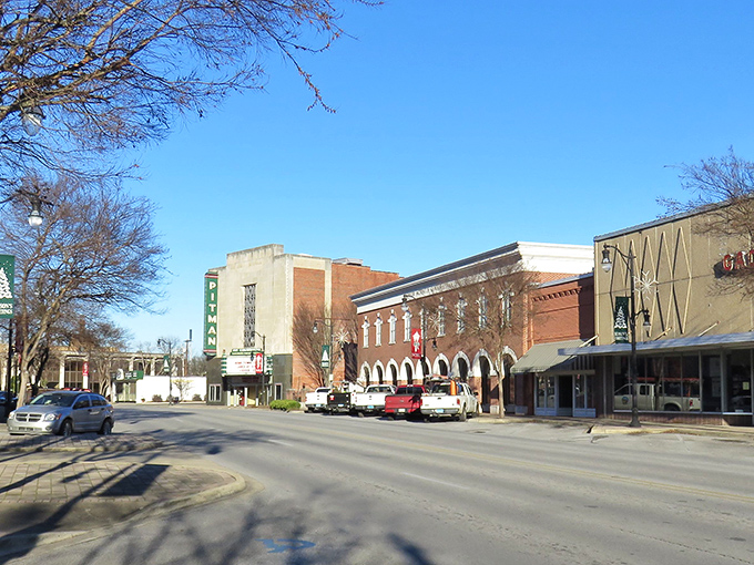 Vintage cars line Gadsden's Broad Street like a time-traveling car show, where yesterday's chrome beauties meet today's treasure hunters.