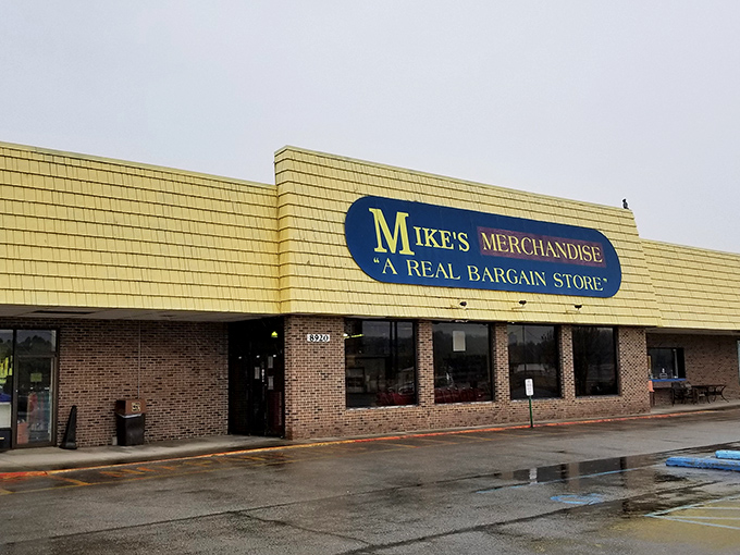The unassuming yellow facade of Mike's Merchandise promises what the sign boldly declares: "A REAL BARGAIN STORE." Understatement of the century!