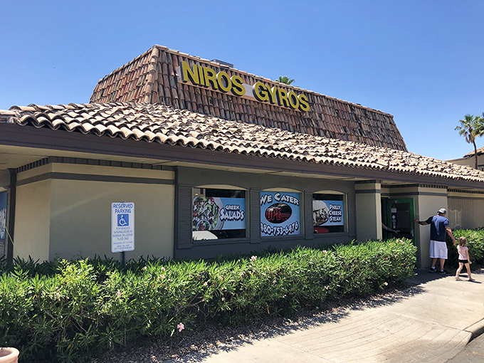 The humble exterior of Niro's Gyros stands like a Mediterranean mirage in the Phoenix desert, complete with classic tile roof and swaying palm trees.