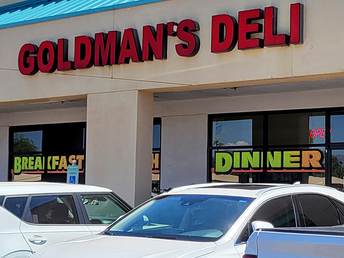 The bright red sign of Goldman's Deli stands out like a beacon of hope for the hungry and homesick. Comfort food paradise awaits!