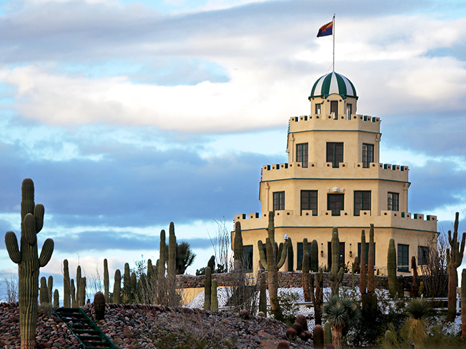 Like a wedding cake rising from the desert, Tovrea Castle stands proudly among thousands of cacti, a surreal vision under Arizona's impossibly blue sky.