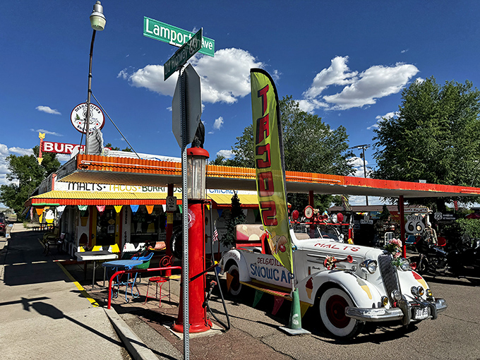 Route 66 nostalgia meets carnival funhouse at Delgadillo's Snow Cap, where even the vintage car out front refuses to take itself seriously.