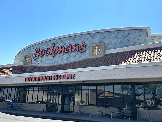 The iconic blue-tiled facade with its bold red Bookmans sign promises adventure before you even step inside. Arizona sunshine makes everything look like possibility.