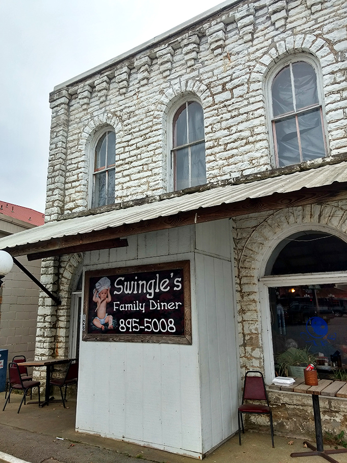 The historic limestone facade of Swingle's stands proudly in Salem, a time-honored beacon for breakfast pilgrims seeking salvation through perfect pancakes.