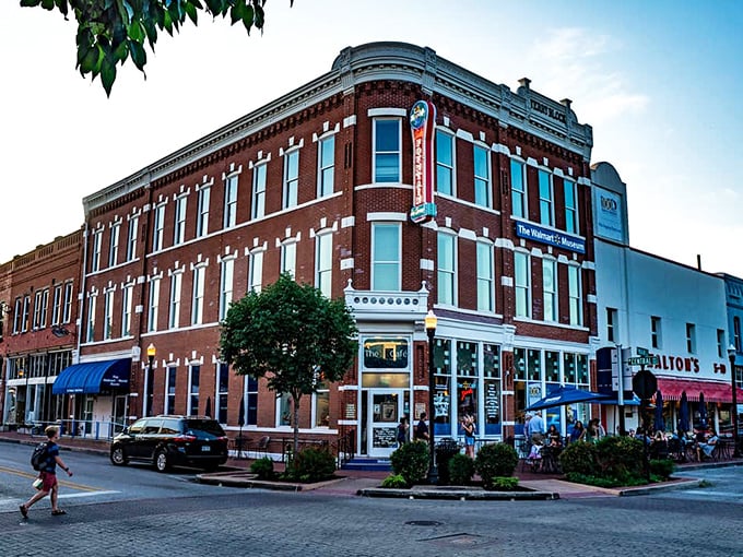 The corner brick building stands like a sentinel of sweetness, promising cold comfort on hot Arkansas afternoons with its classic soda fountain charm.
