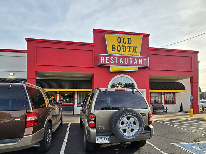 The bright red exterior with bold yellow signage isn't trying to be subtle – it's proudly announcing "good food happens here!" No Instagram filter required.