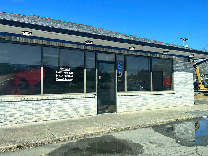The unassuming storefront where donut dreams come true. Blue skies above, sweet treasures within&mdash;North Little Rock's hidden gem awaits.