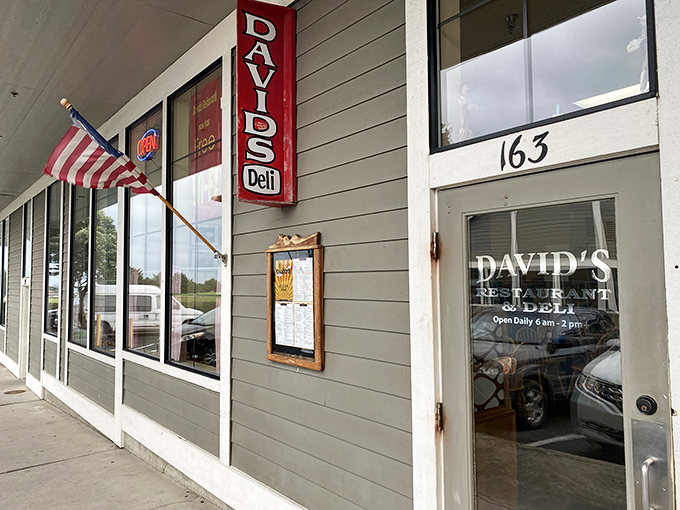 The unassuming storefront that launches a thousand breakfast dreams. American flag proudly waving, as if announcing: "Patriotism and pancakes served here!"