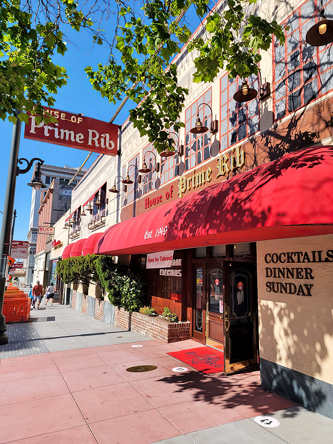 The iconic red awning of House of Prime Rib beckons like a meaty lighthouse on Van Ness Avenue, promising carnivorous delights within.