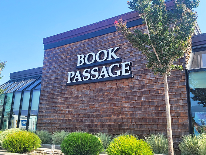 The brick facade of Book Passage beckons like a literary lighthouse, promising safe harbor for readers adrift in a sea of mediocre entertainment options.
