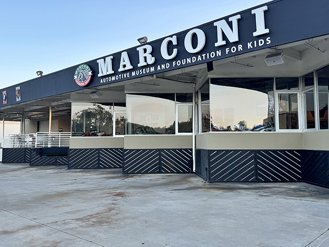 The unassuming exterior of Marconi Automotive Museum belies the treasures within, like finding a Ferrari dealership hiding behind what looks like your accountant's office.