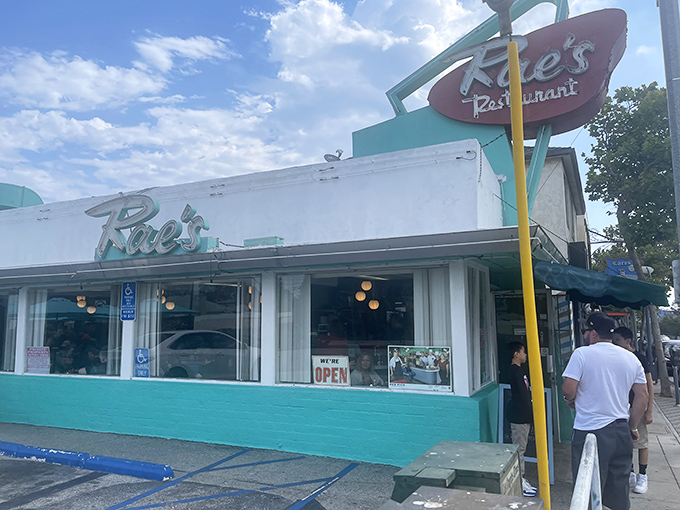 The turquoise-trimmed time capsule beckons with its vintage neon sign &ndash; a beacon of breakfast hope on Pico Boulevard where pancake dreams come true.