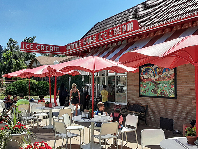 The iconic red-striped awning of Bonnie Brae Ice Cream stands as Denver's beacon of frozen happiness, drawing crowds even on chilly Colorado evenings.