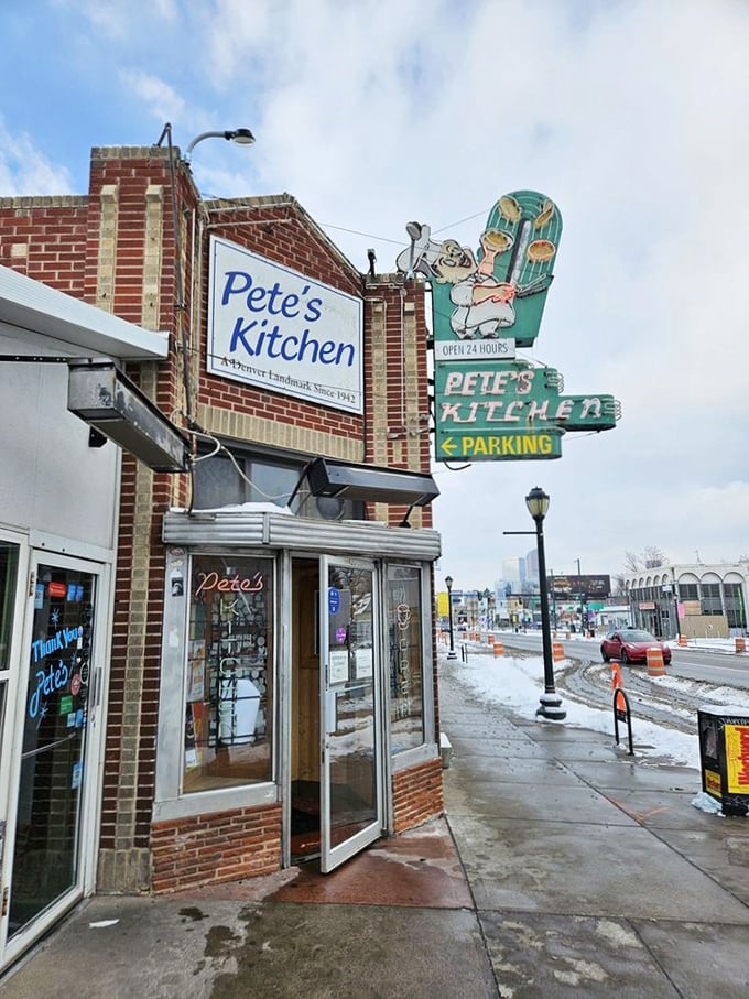 The neon glow of Pete's Kitchen at dusk isn't just a sign&mdash;it's a beacon of hope for hungry souls wandering Colfax Avenue. 