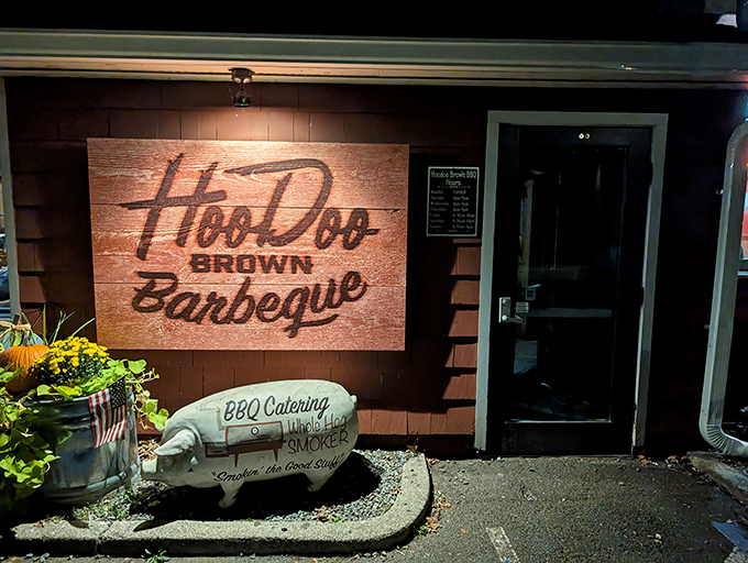 The unassuming red exterior hides barbecue greatness like Clark Kent's glasses hide Superman. The sign is your beacon to smoky paradise.