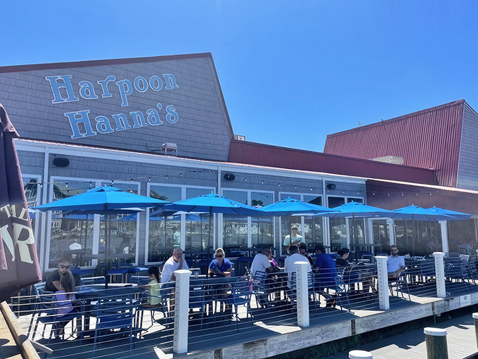 The classic blue sign beckons like a lighthouse for hungry travelers – promising delicious refuge from typical beach town fare.