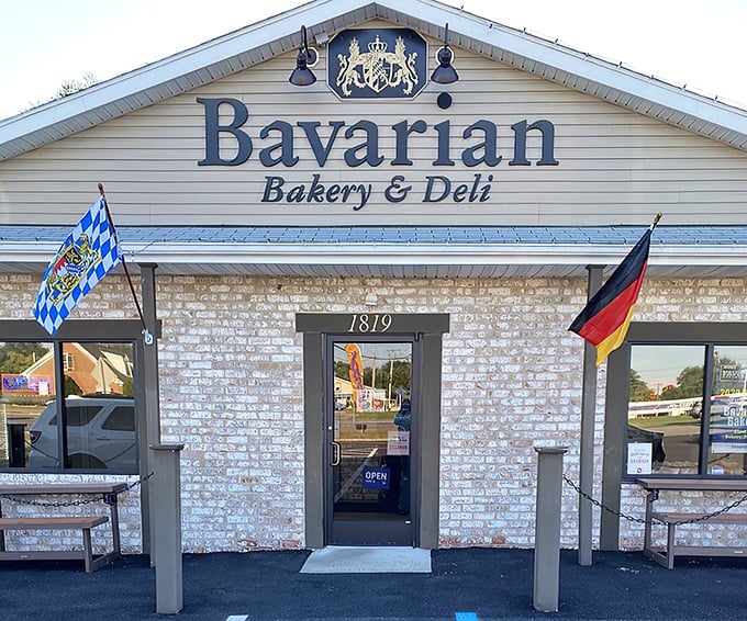 The Bavarian dream awaits! This charming stone-faced building with its distinctive flags and royal crest promises authentic German delights inside.
