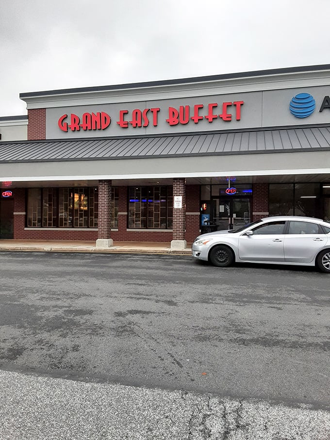 The bold red lettering of Grand East Buffet beckons hungry patrons like a lighthouse guiding ships to harbor. This unassuming strip mall location houses a treasure trove of culinary delights.