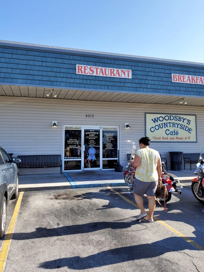 The unassuming exterior of Woodsby's Countryside Cafe stands as a beacon of hope for hungry travelers. No fancy frills, just the promise of honest food inside.