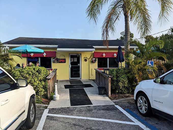 The cheerful yellow exterior with pink awnings isn't just inviting&mdash;it's practically shouting "breakfast is served!" Palm trees and a wooden deck complete this slice of Florida comfort.