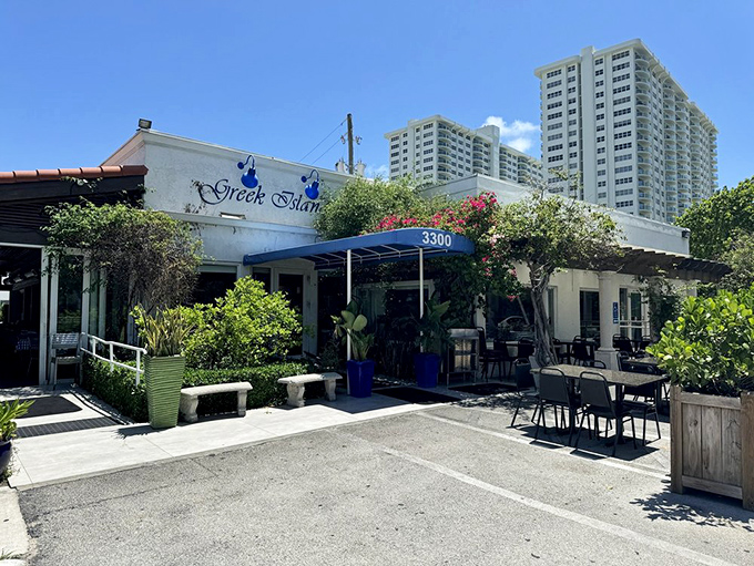 The blue and white exterior of Greek Islands Taverna stands like a Mediterranean mirage among Fort Lauderdale's high-rises. A perfect postcard from Greece without the jet lag.