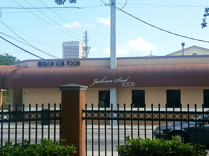 The unassuming exterior of Jackson Soul Food stands like a culinary lighthouse in Overtown, beckoning hungry travelers with promises of Southern comfort.
