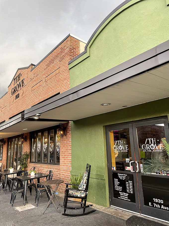 The historic brick facade of 7th + Grove stands proudly against Tampa's blue sky, promising Southern delights within its welcoming walls.