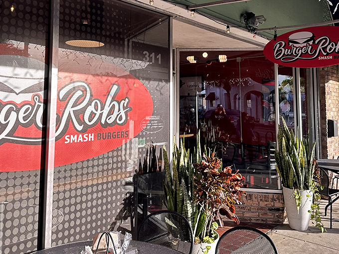 The unassuming storefront of BurgerRobs in Titusville beckons with its red signage and outdoor seating&mdash;a burger sanctuary hiding in plain sight.